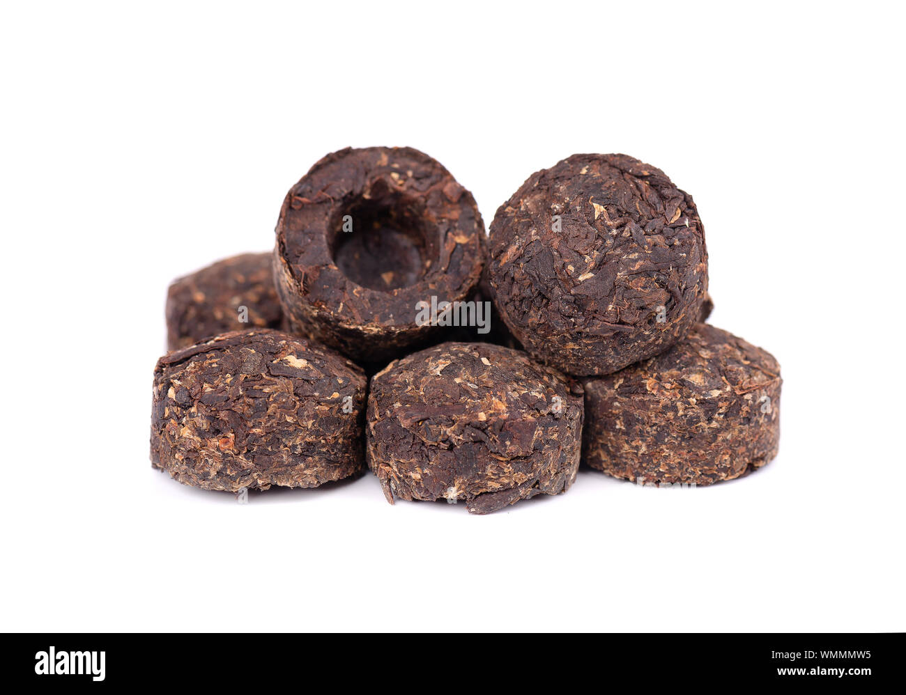 Aromatic black pu-erh tea, isolated on white background. Close up ...