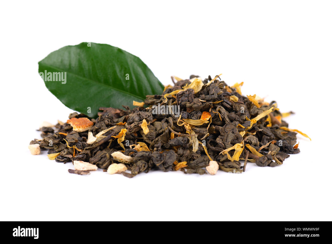 Green Ceylon tea with dry flowers and candied orange, isolated on white ...