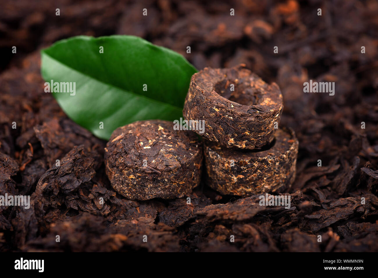 Aromatic black pu-erh tea. Fermented and compressed Leaves into bricks ...