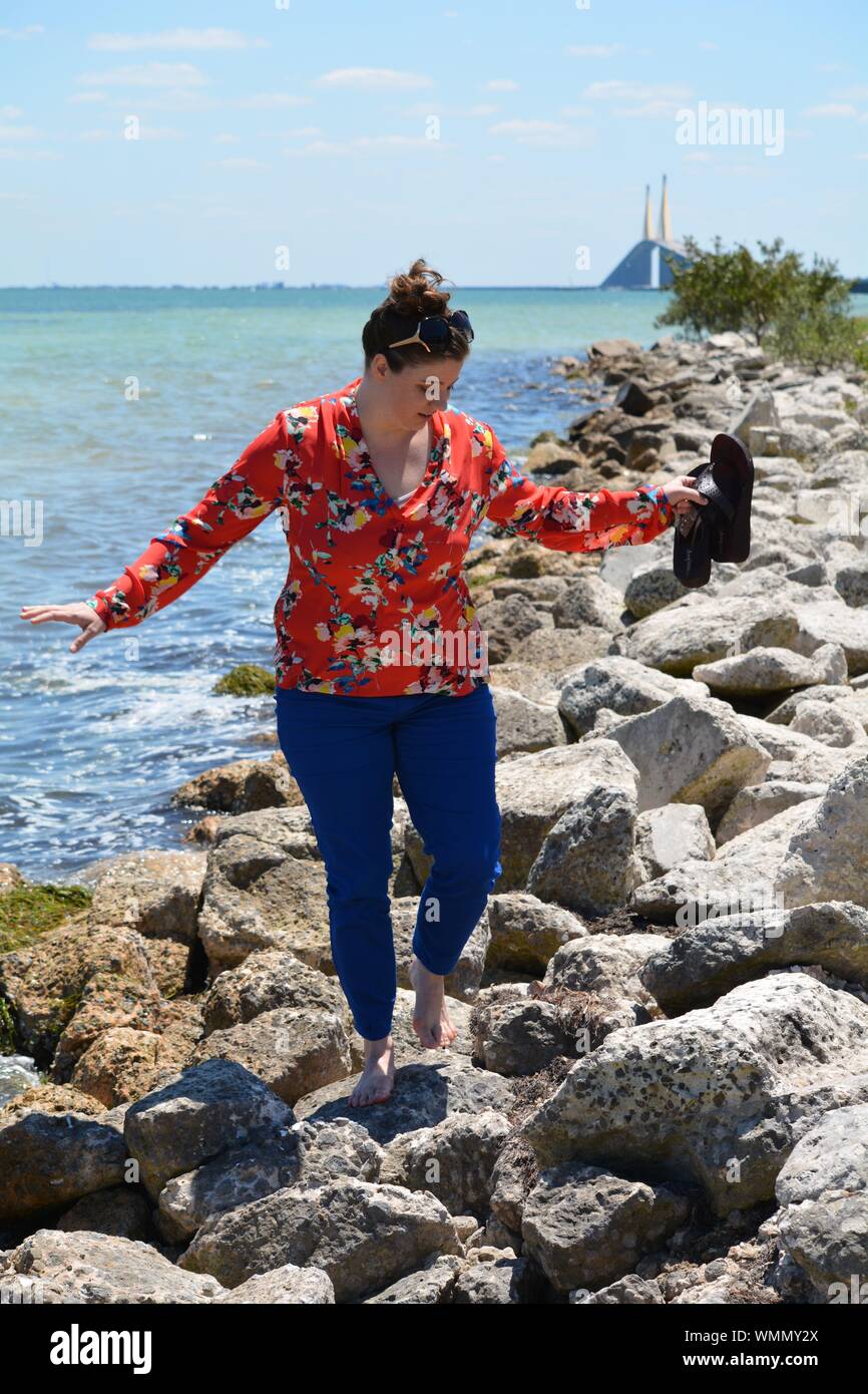 Young woman holding slippers hi-res stock photography and images - Alamy