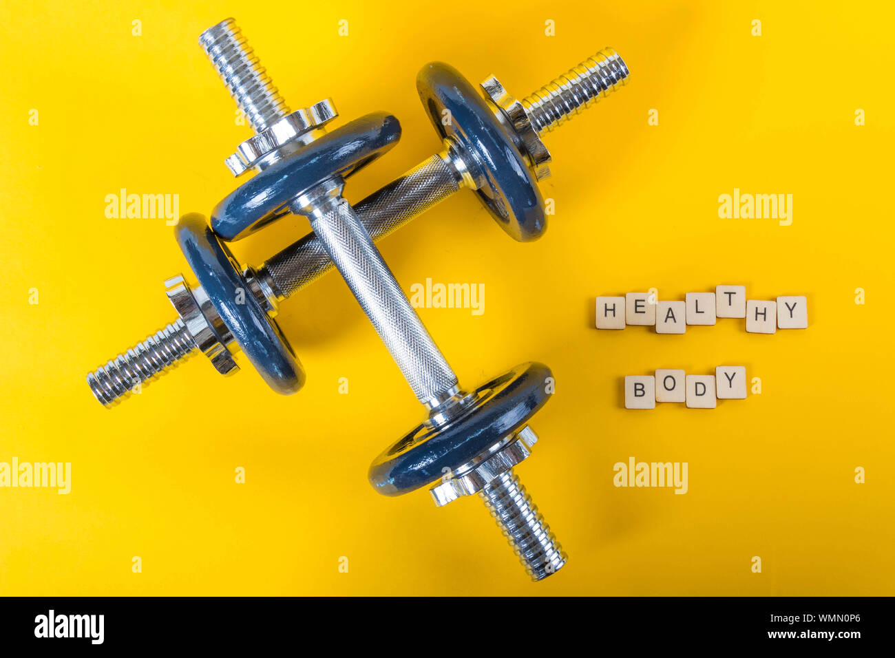 Healthcare concept showing dumbbells and the message healthy body Stock ...