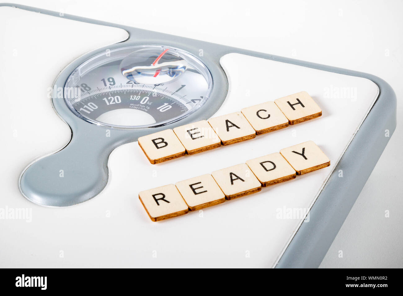 Healthcare concept showing bathroom scales and the message beach ready ...