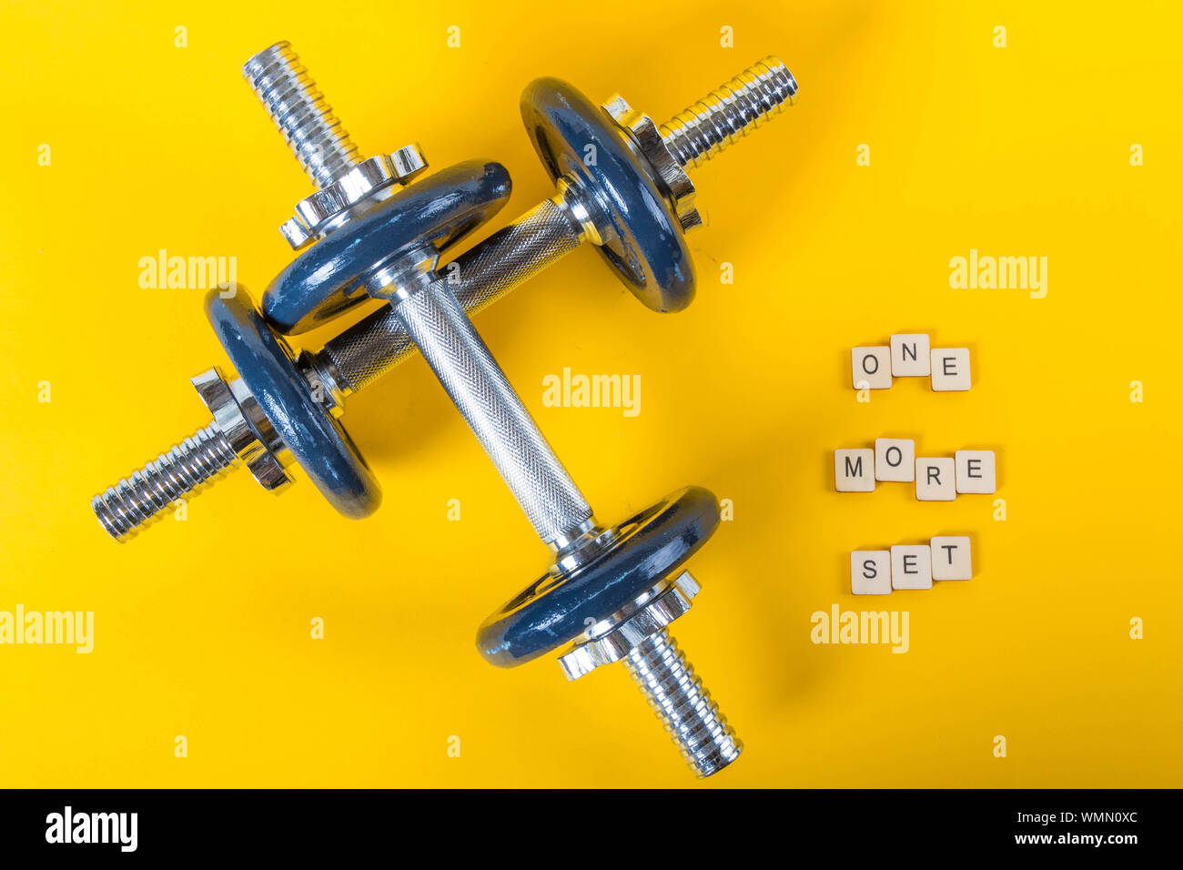 Healthcare concept showing dumbbells and the message one more set Stock ...