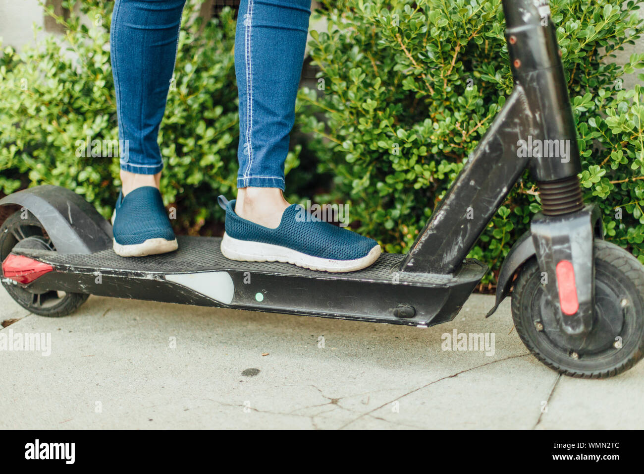 Feet on a scooter Stock Photo - Alamy