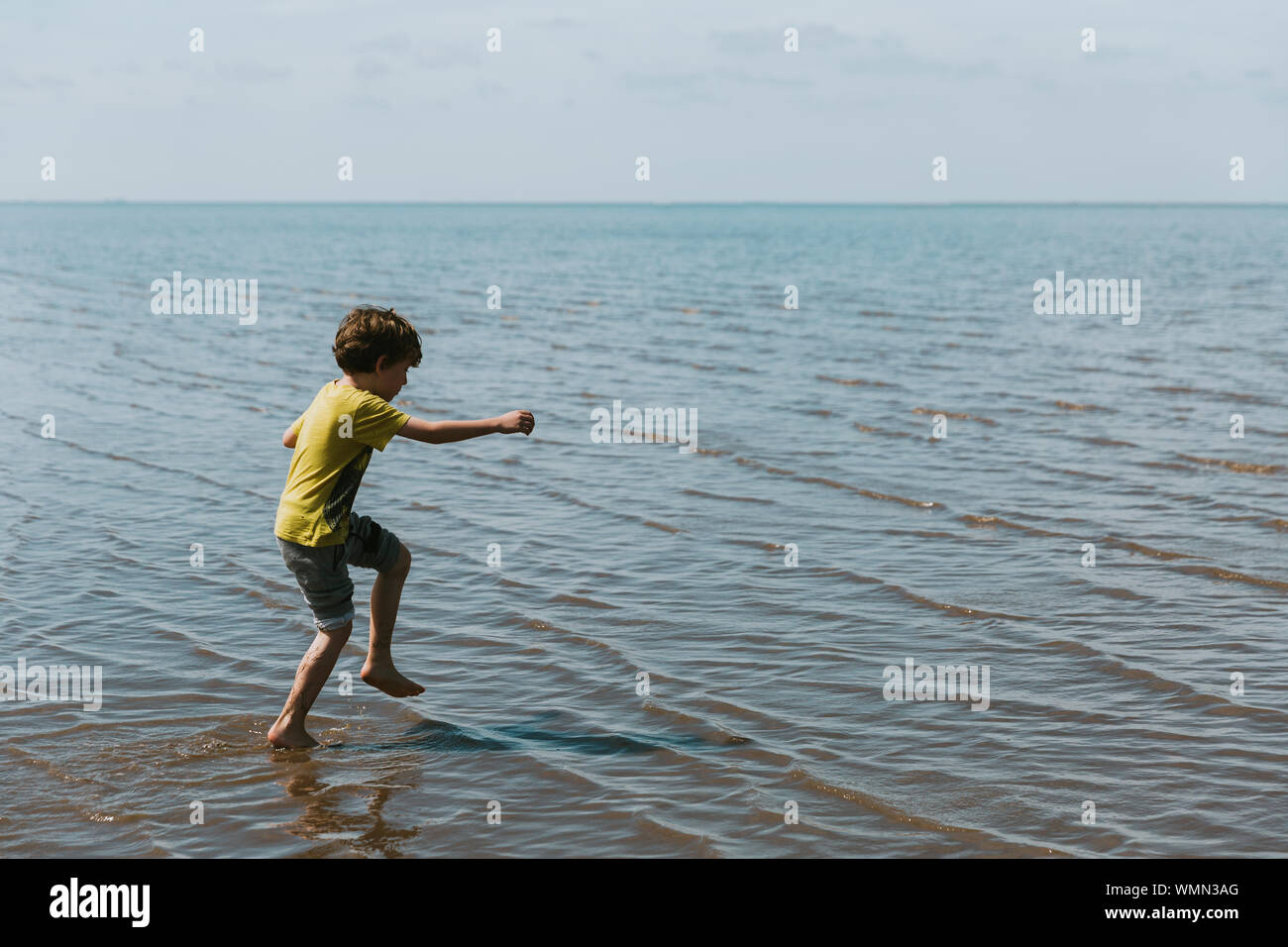 Children paddling sea hi-res stock photography and images - Alamy