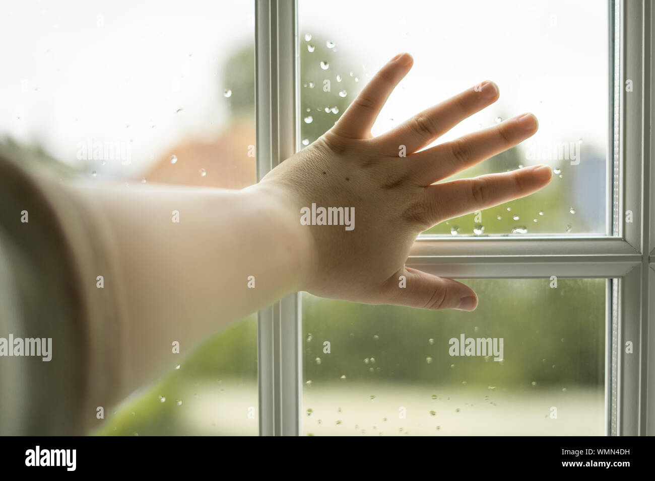 Hand against window hi-res stock photography and images - Alamy