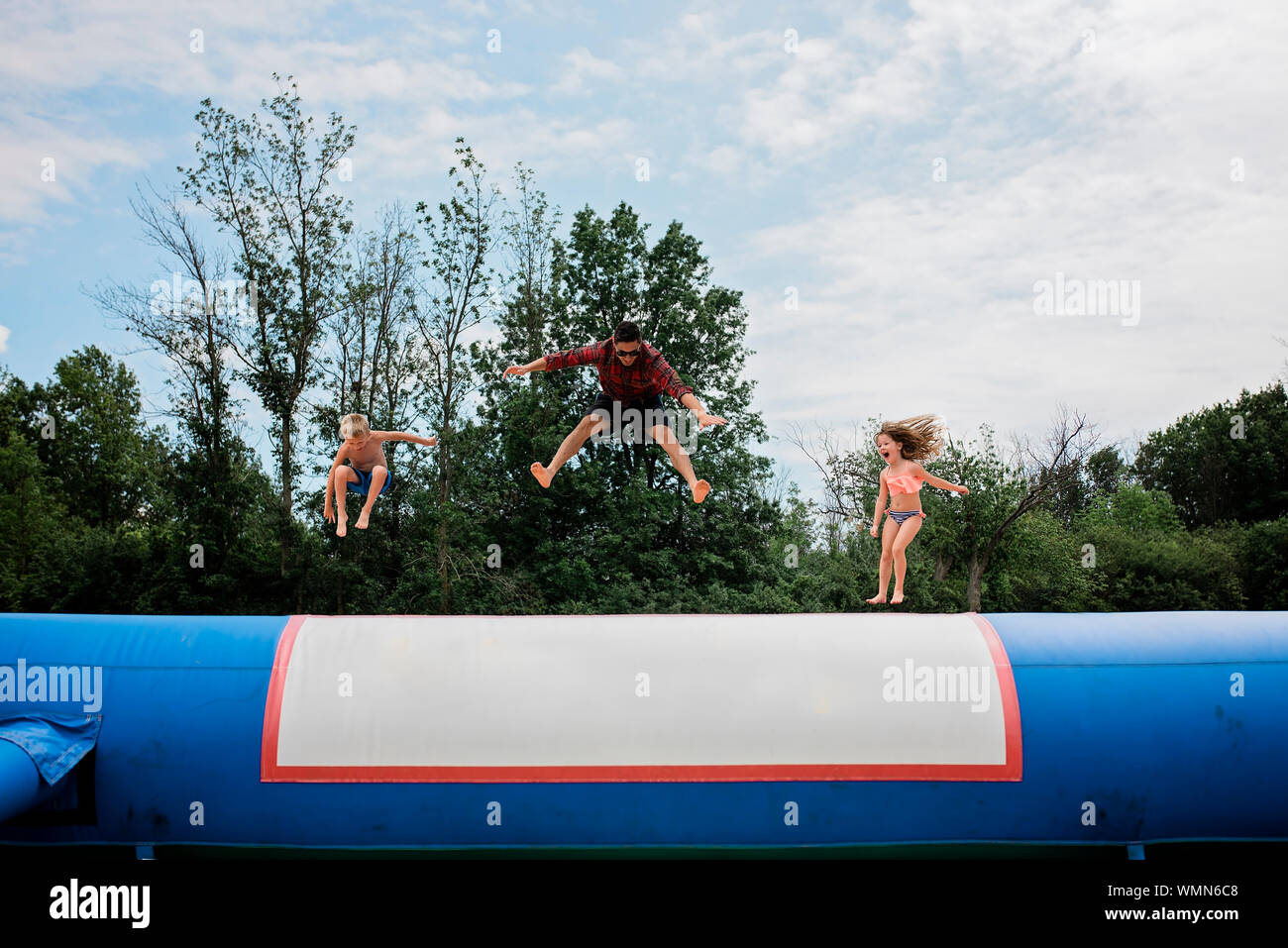 Children playing outside blue sky hi-res stock photography and images ...