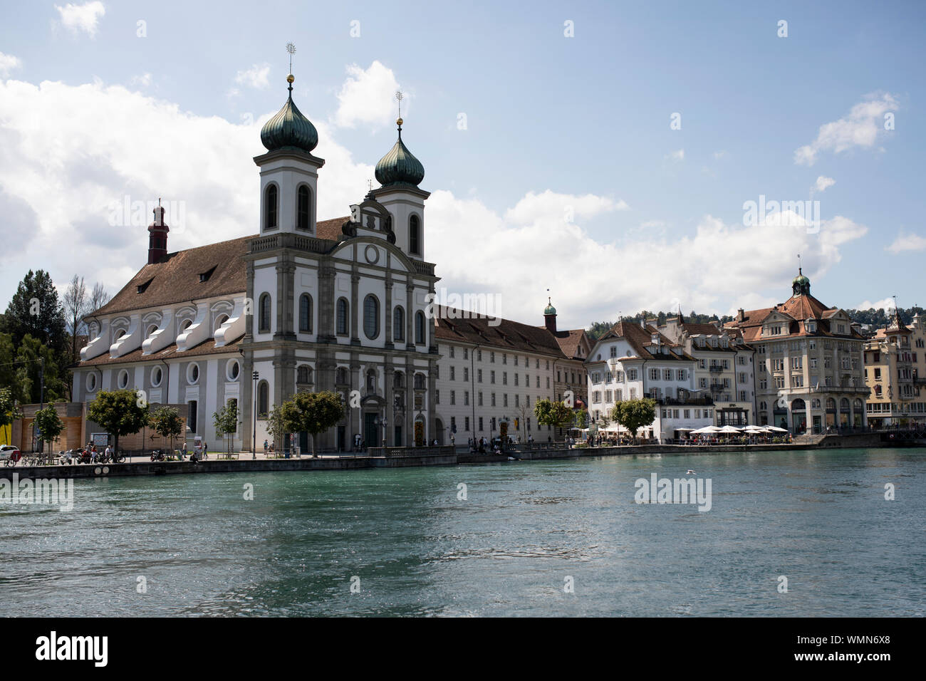 The baroque Jesuit Church along the Reuss River in the old town of ...