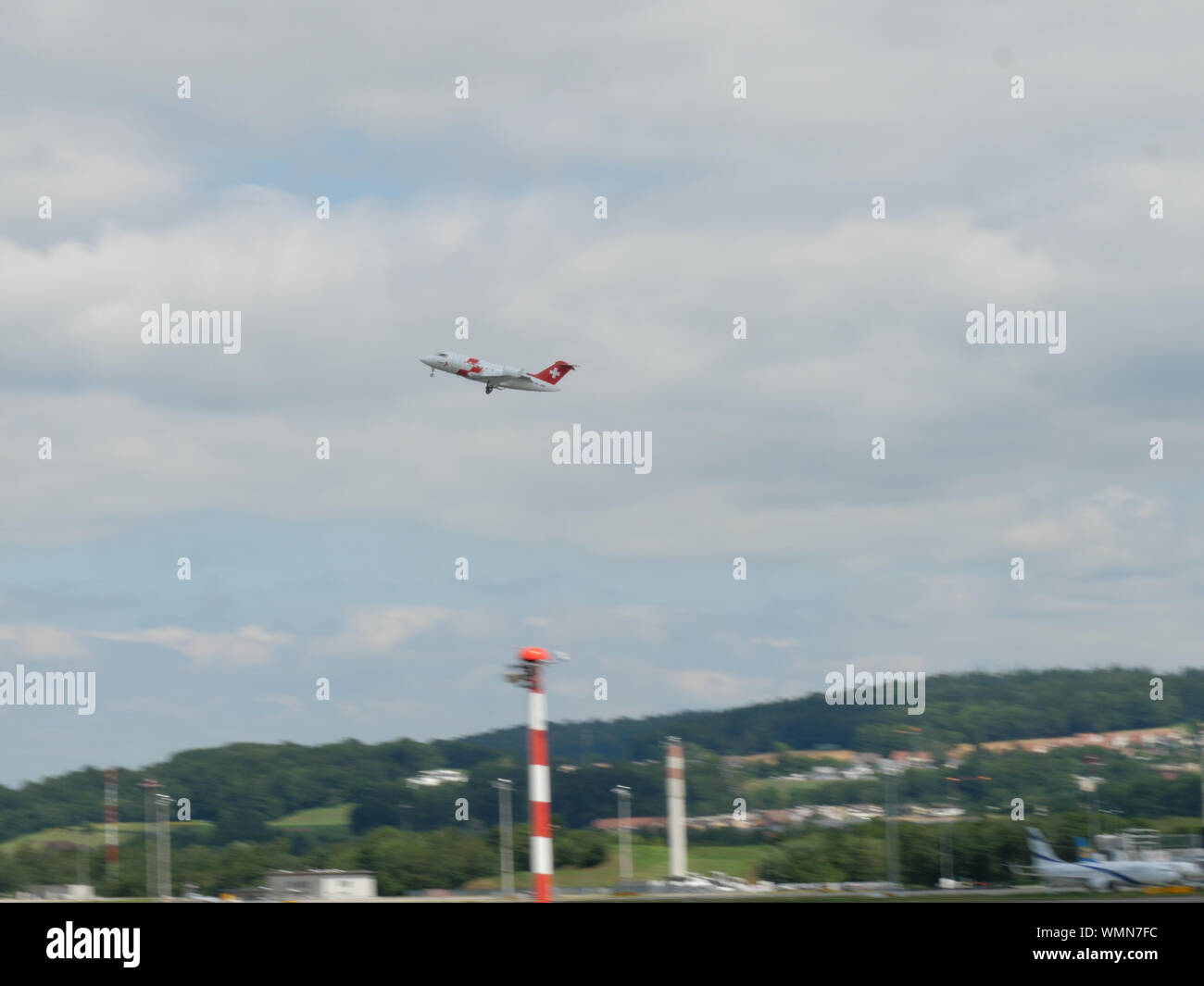 Swiss Air Ambulance REGA jet take-off at ZRH Stock Photo - Alamy