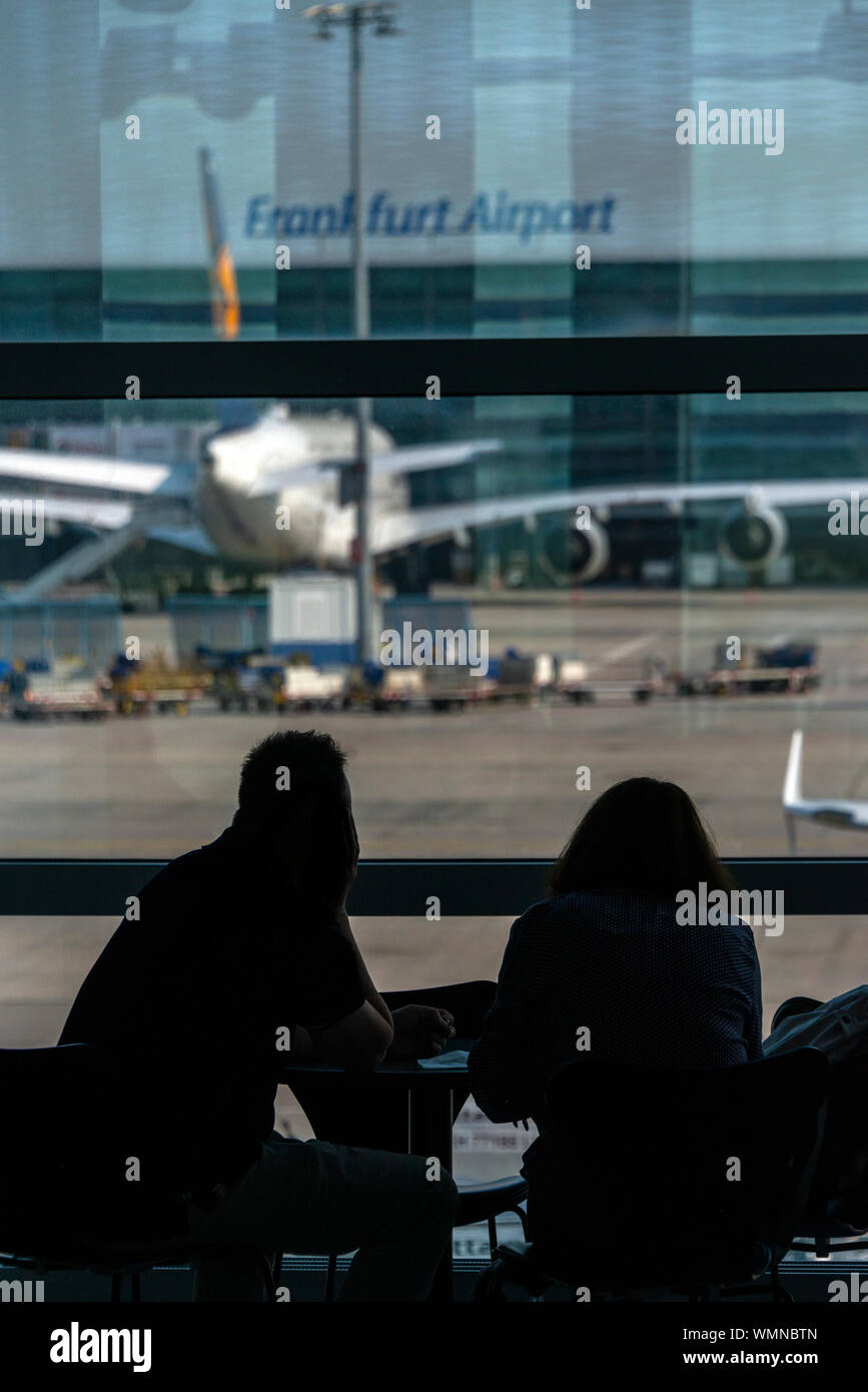 Portrait view of a silhouetted couple with an Airbus aircraft at ...