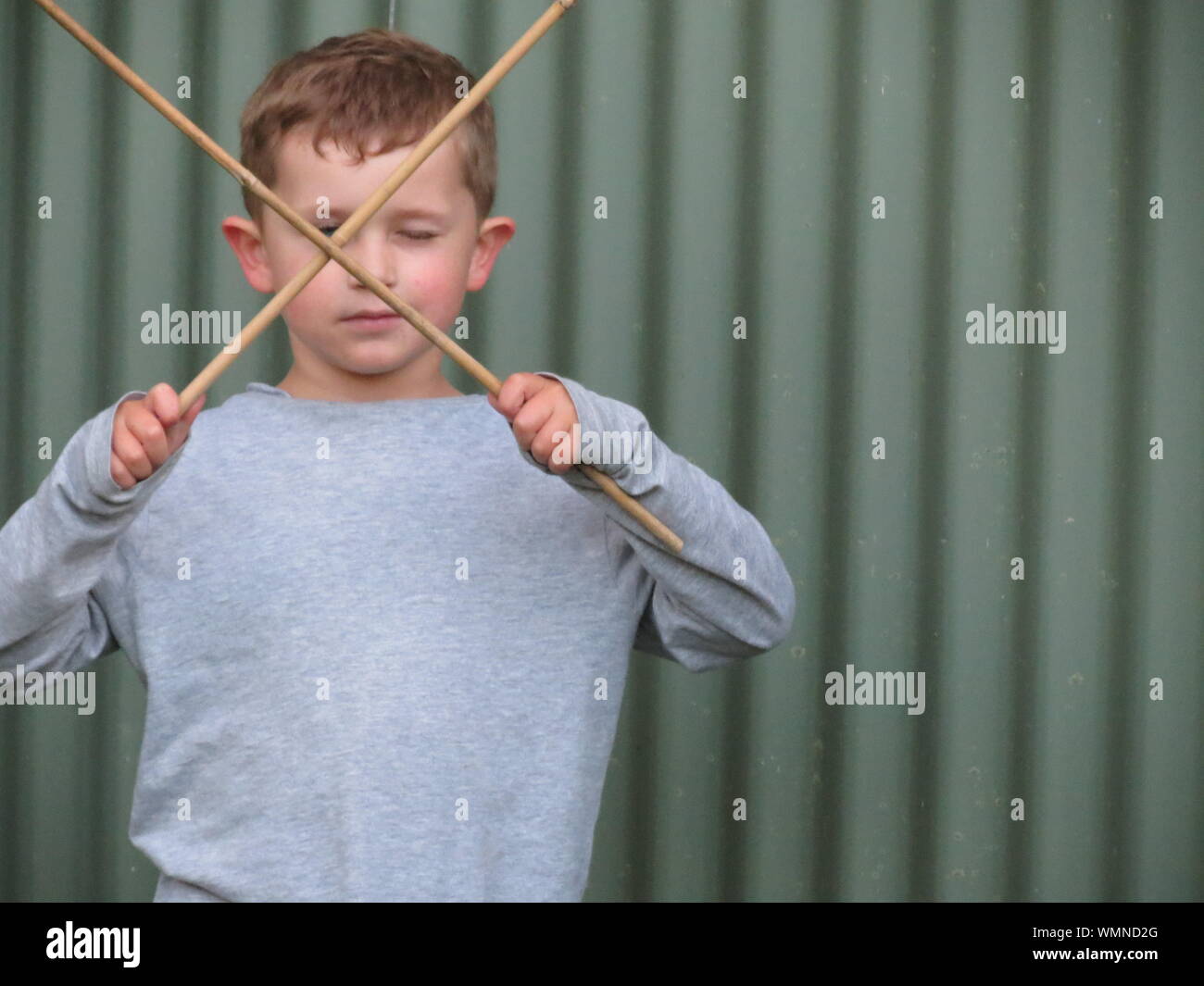 Boys holding sticks hi-res stock photography and images - Alamy