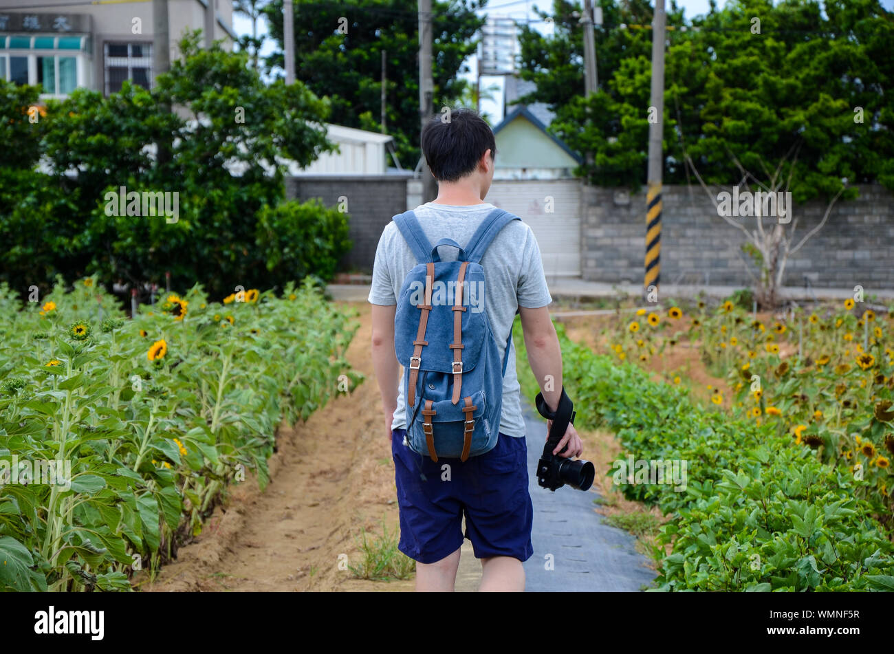 Man walking with camera hi-res stock photography and images - Alamy