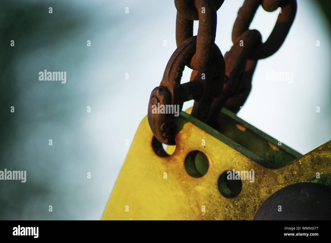 Metallic Chains Connected To Machine Stock Photo - Alamy