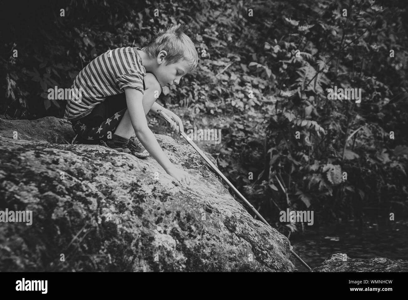 Full length boy side view Black and White Stock Photos & Images - Alamy