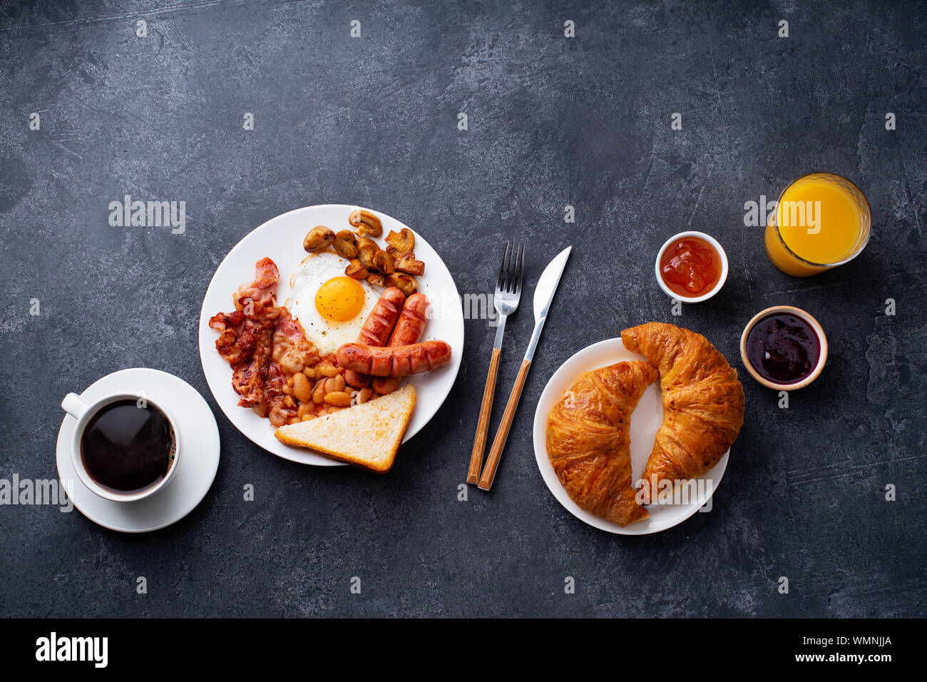 Classical english breakfast with fried bacon, mushrooms and eggs ...