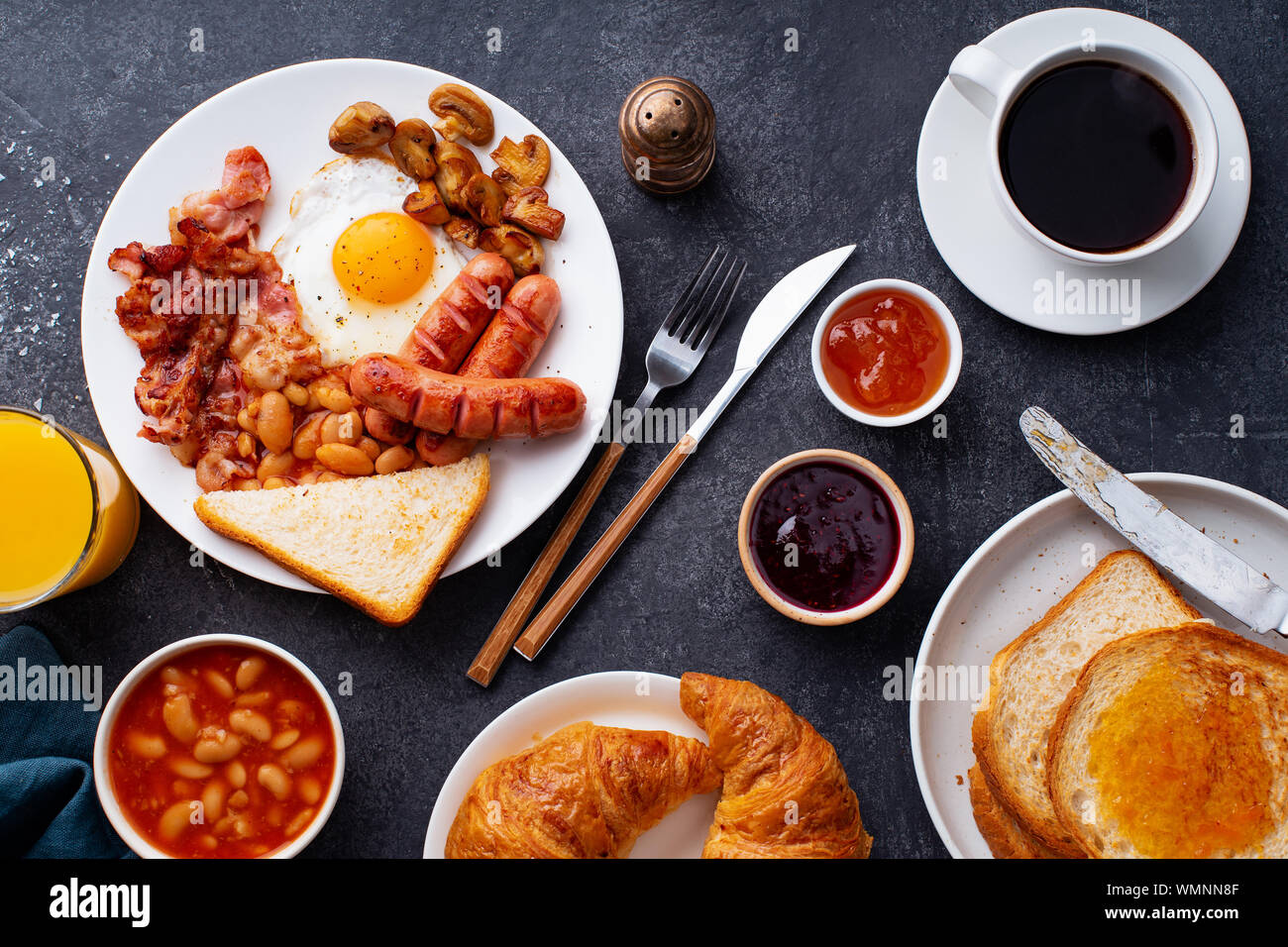Top view flatlay with classical english breakfast with fried bacon ...