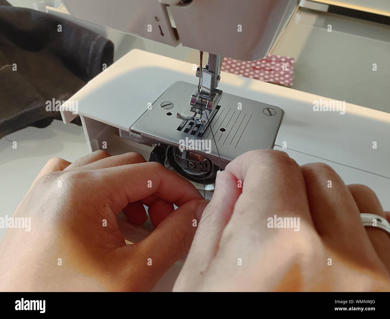 Woman is sewing hi-res stock photography and images - Alamy