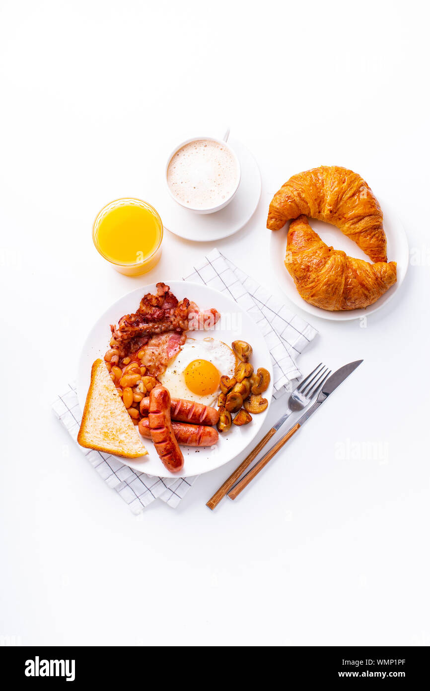 Top view flatlay with classical english breakfast with fried bacon ...