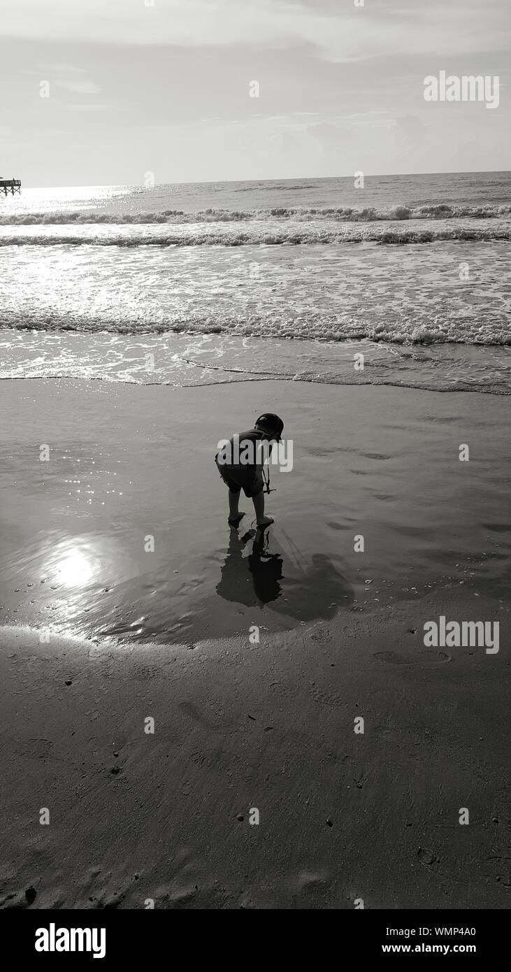 Boy bending over rear hi-res stock photography and images - Alamy