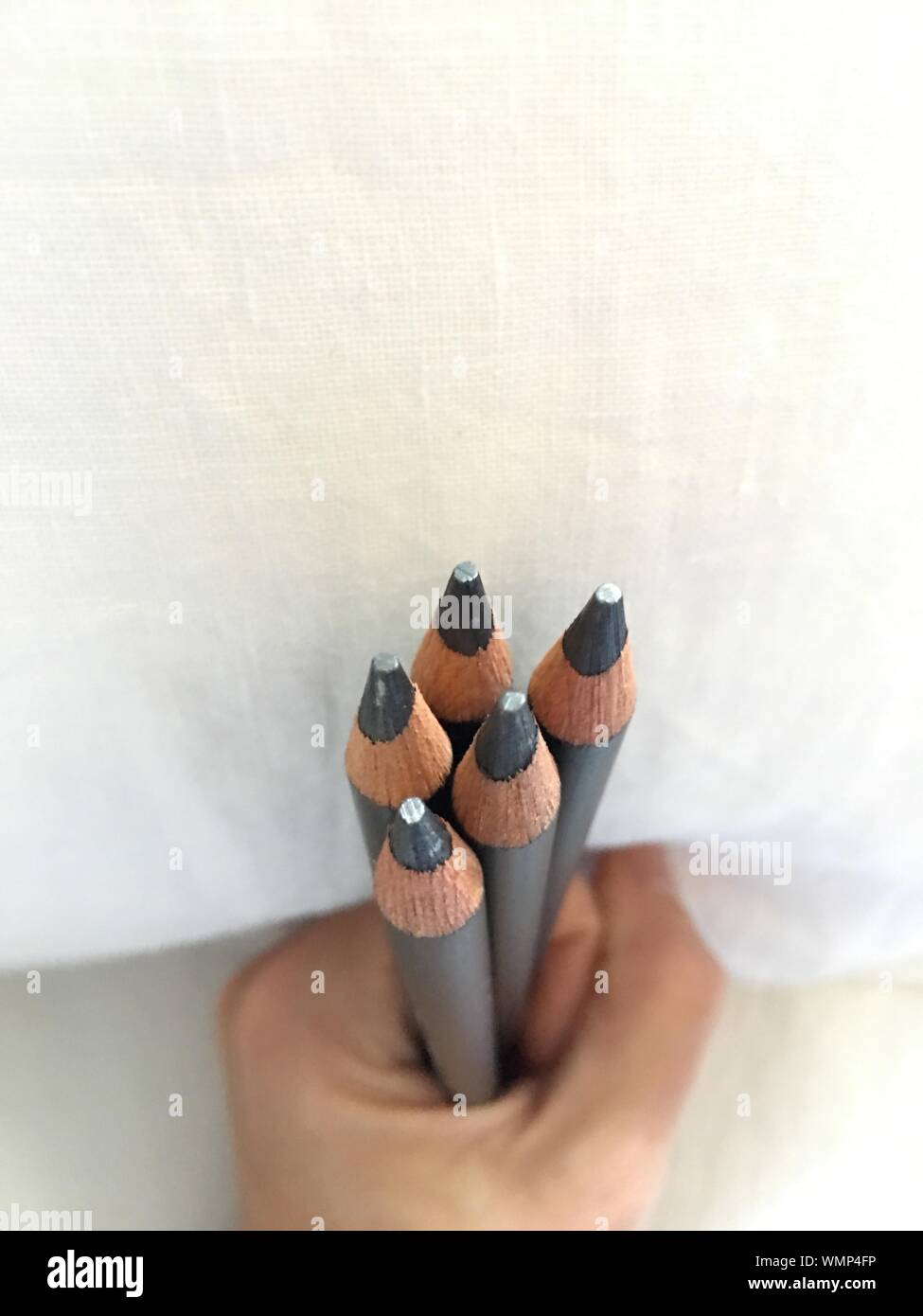 Hand holding pencils hi-res stock photography and images - Alamy