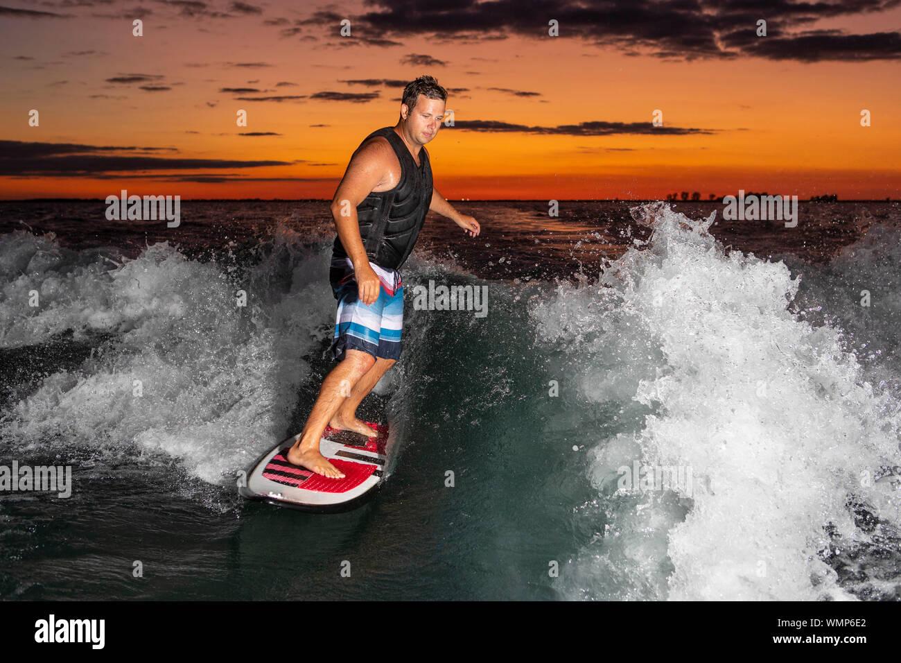 Man wakesurfing hi-res stock photography and images - Alamy