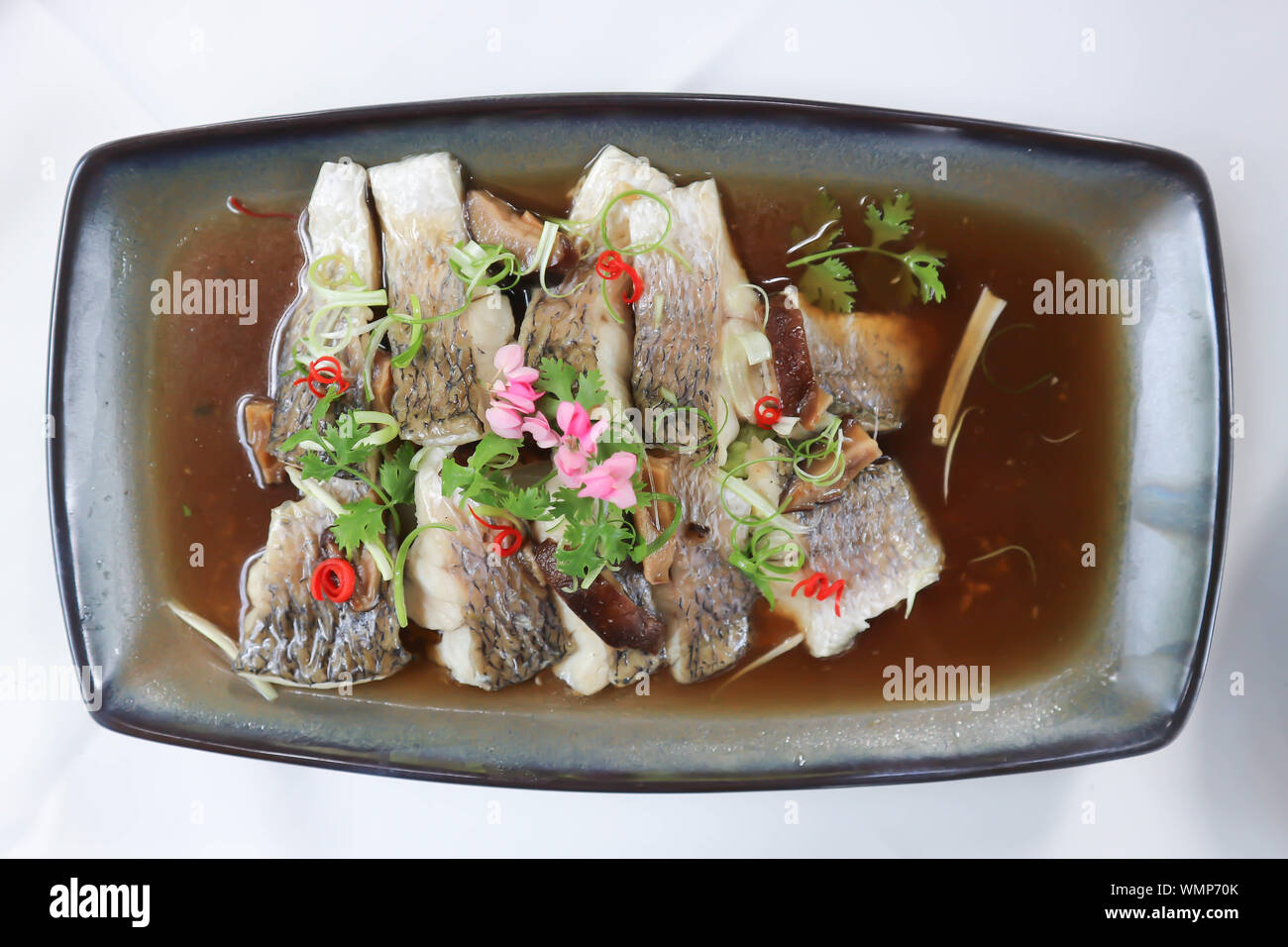 steamed fish, steamed striped bass or stewed bass fish Stock Photo - Alamy