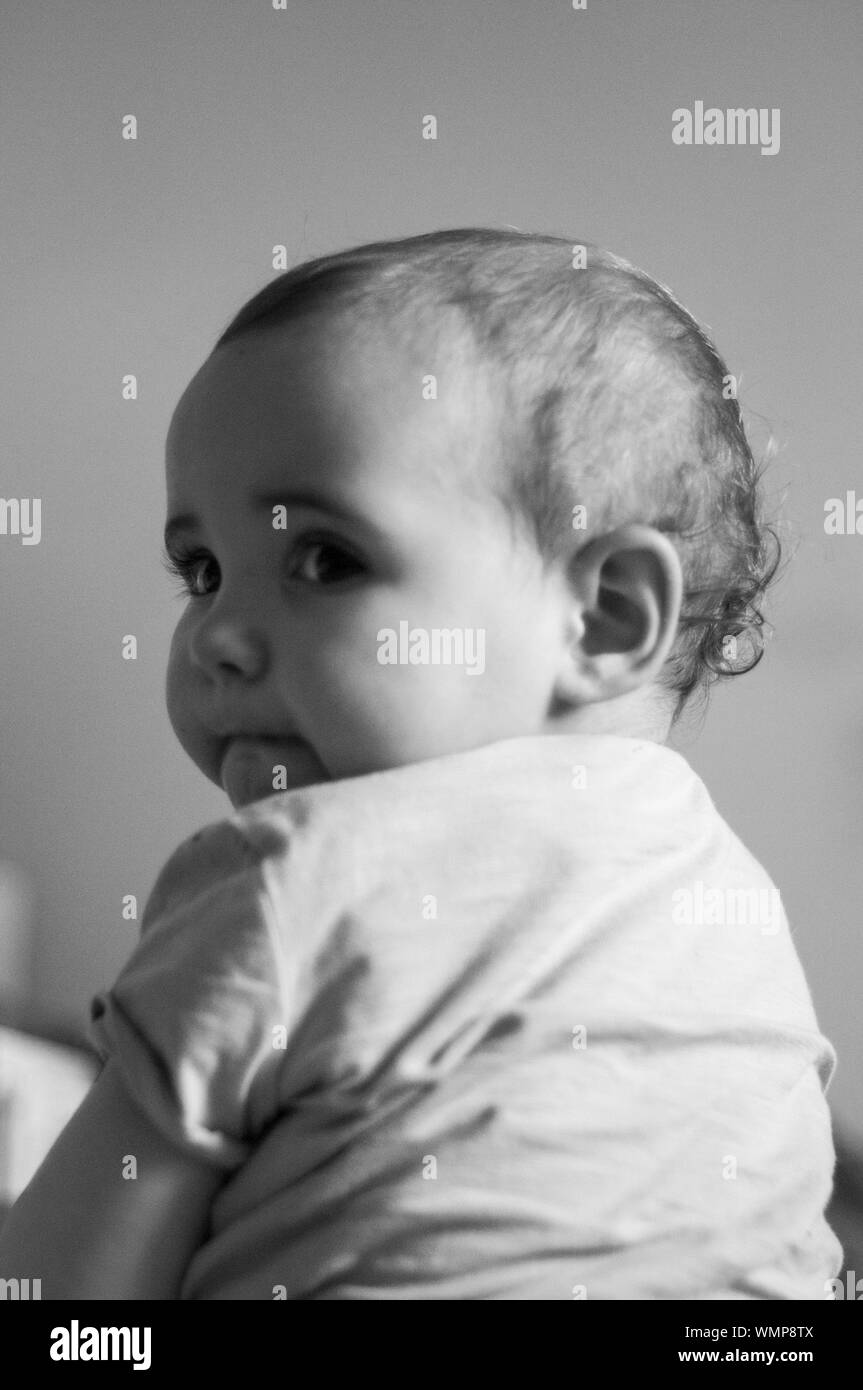 Boy looking over the wall Black and White Stock Photos & Images - Alamy