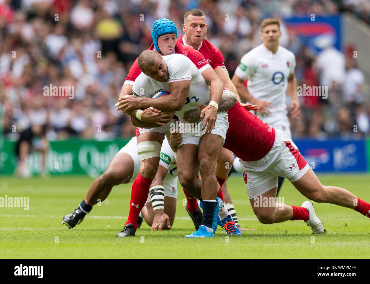 Jonathan Joseph of England and Justin Tipuric of Wales during the ...