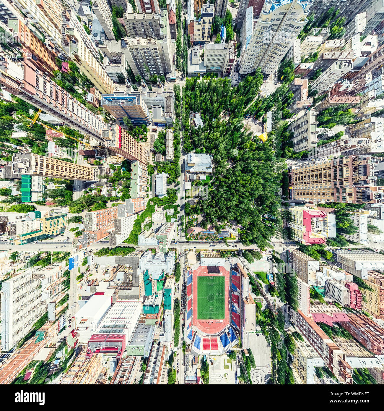 Aerial city view with crossroads and roads, houses, buildings, parks ...