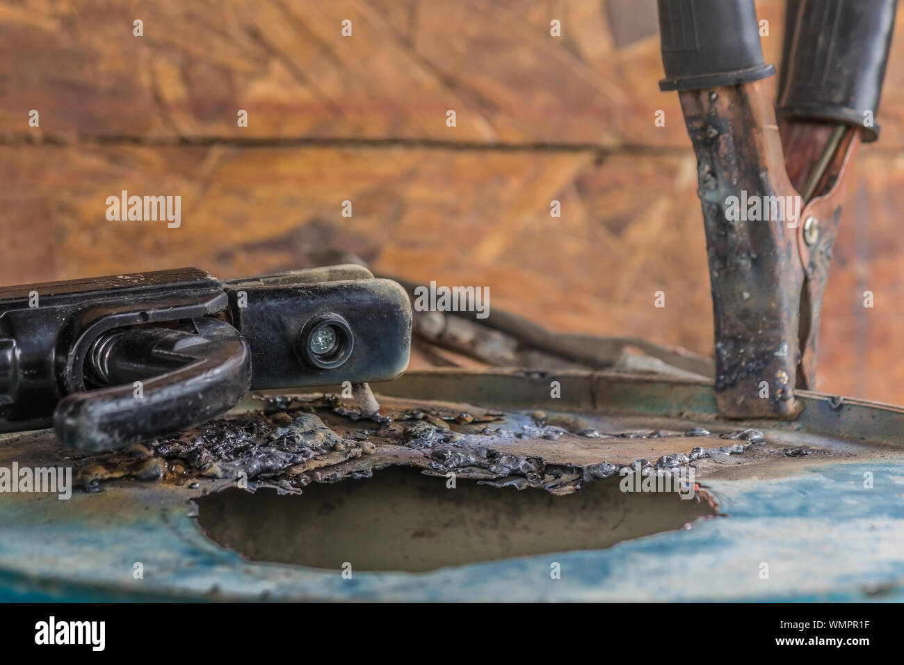 Finishing bad welding Process with blue tube metal Stock Photo - Alamy