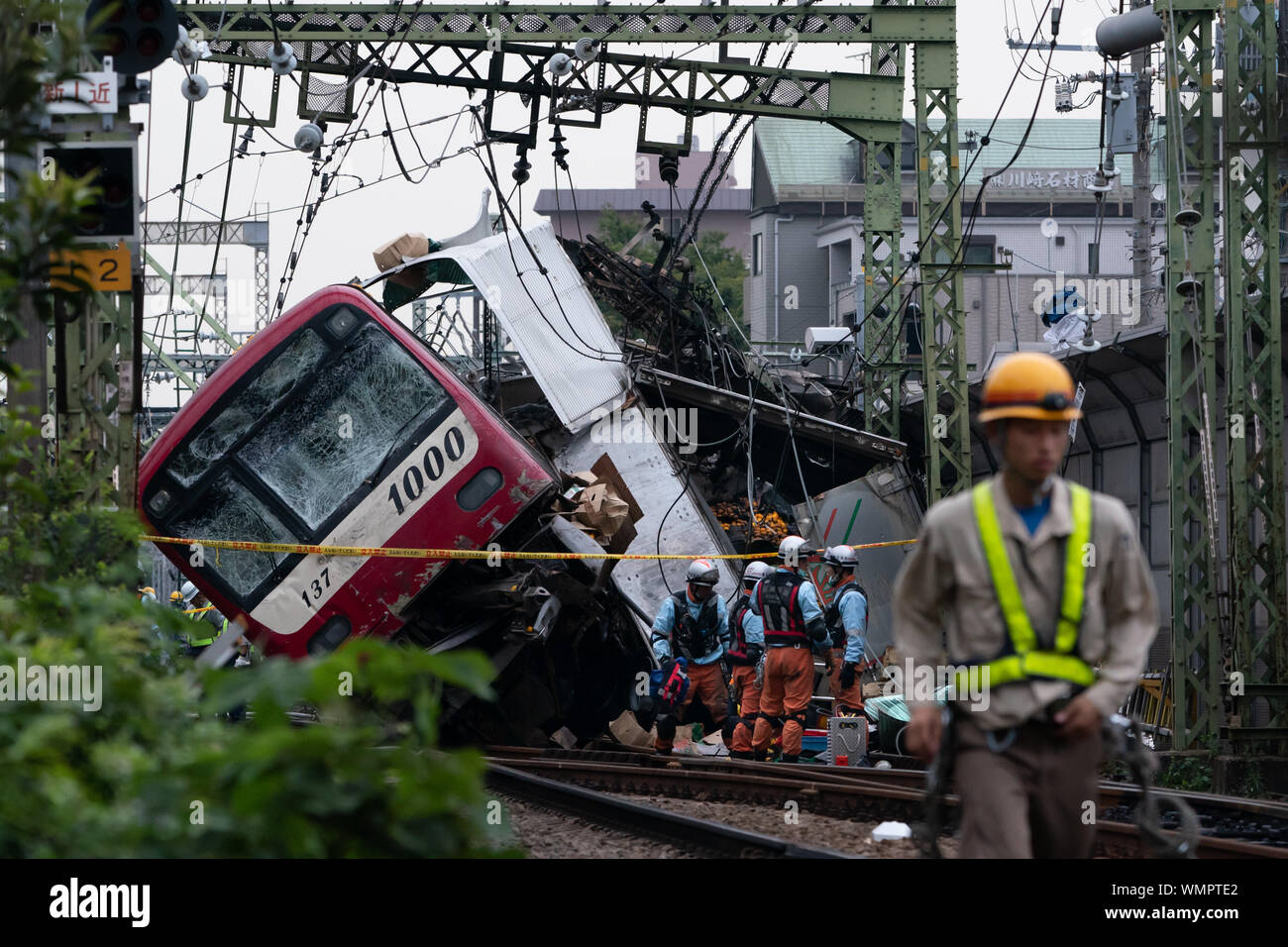 Fire brigade and policemen at the Kanagawa-Shinmachi station in ...