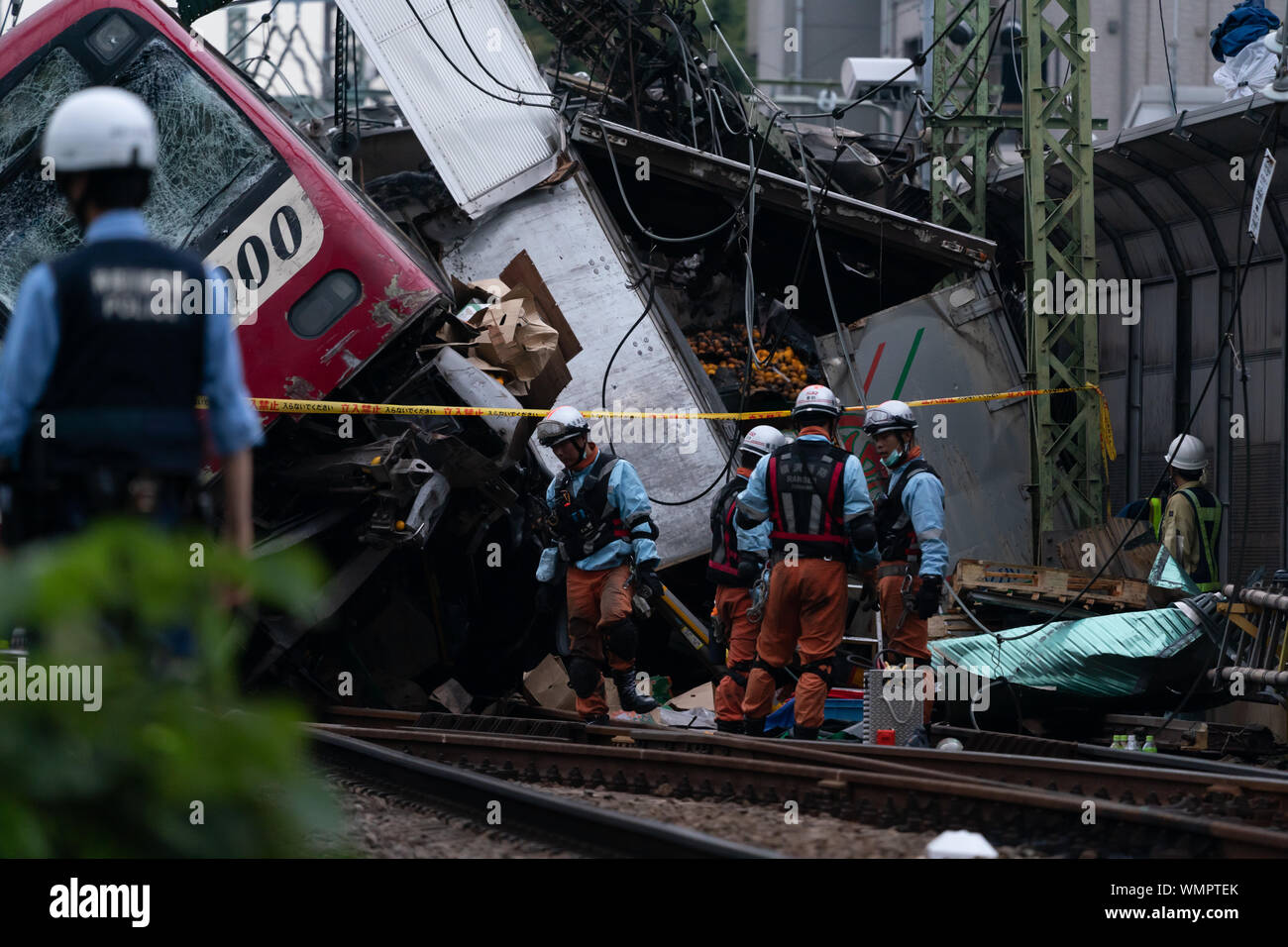 Fire brigade and policemen at the Kanagawa-Shinmachi station in ...