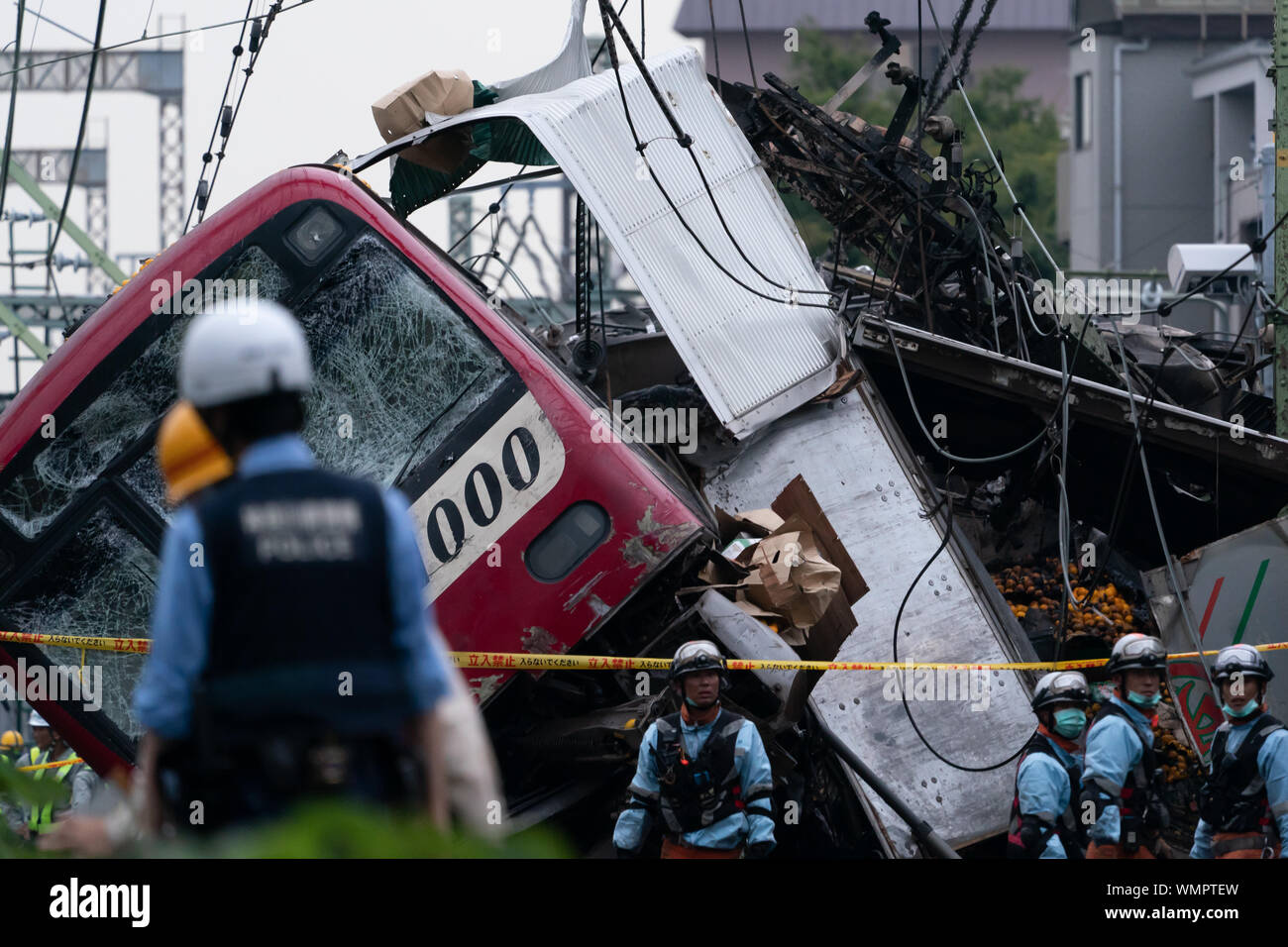 Fire brigade and policemen at the Kanagawa-Shinmachi station in ...