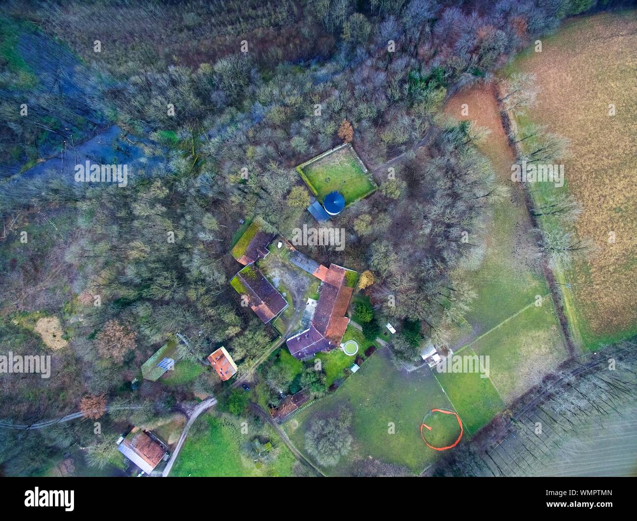 House above trees hi-res stock photography and images - Alamy