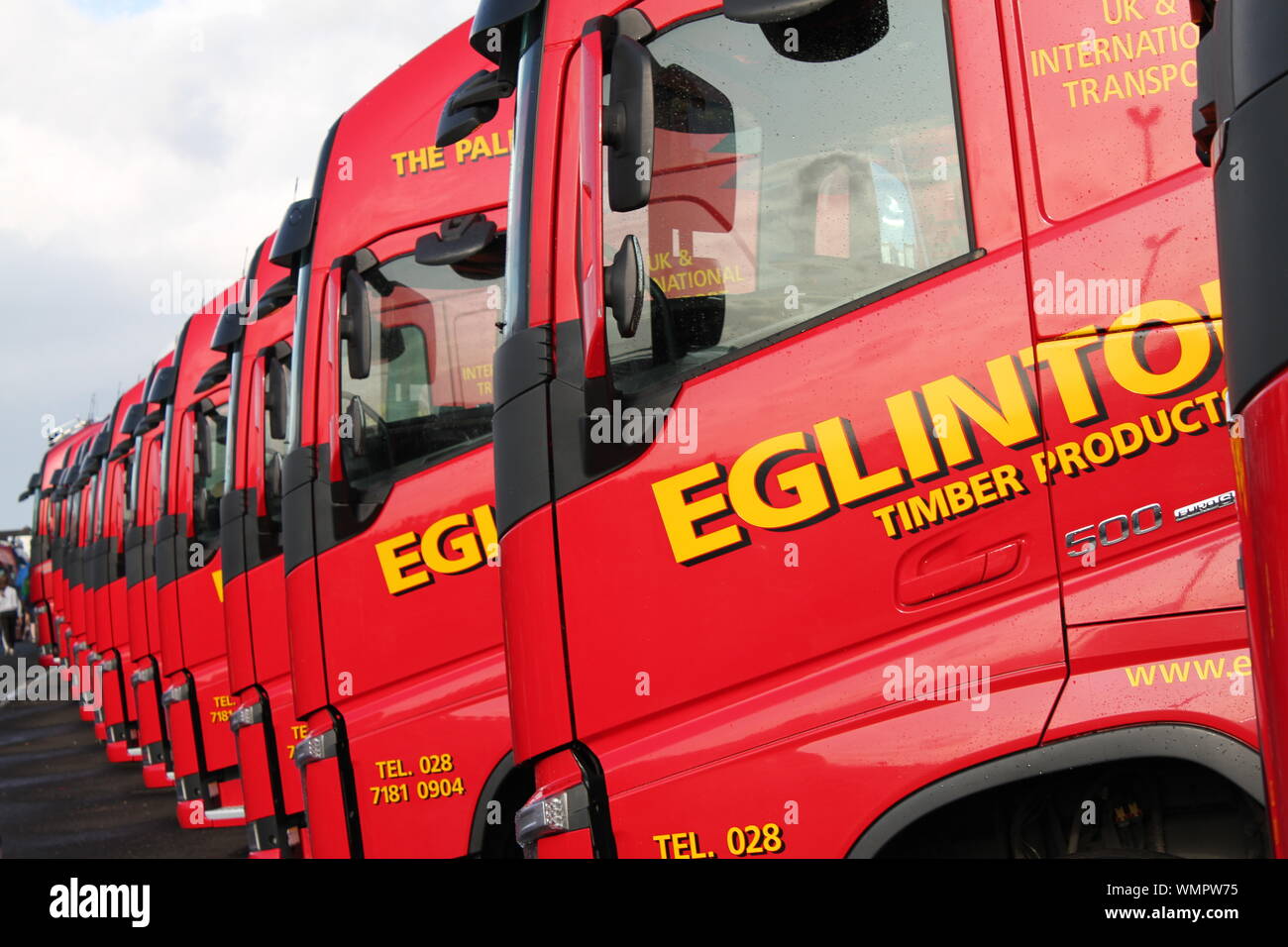 A row of red Volvo Eglinton Timber Products lorries seen at Causeway ...