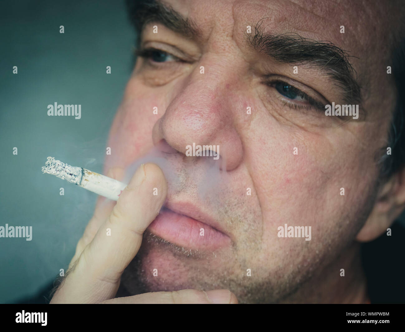 Man smoking cigarette hi-res stock photography and images - Alamy
