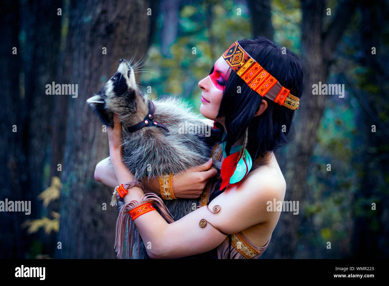 Woman holding raccoon hi-res stock photography and images - Alamy