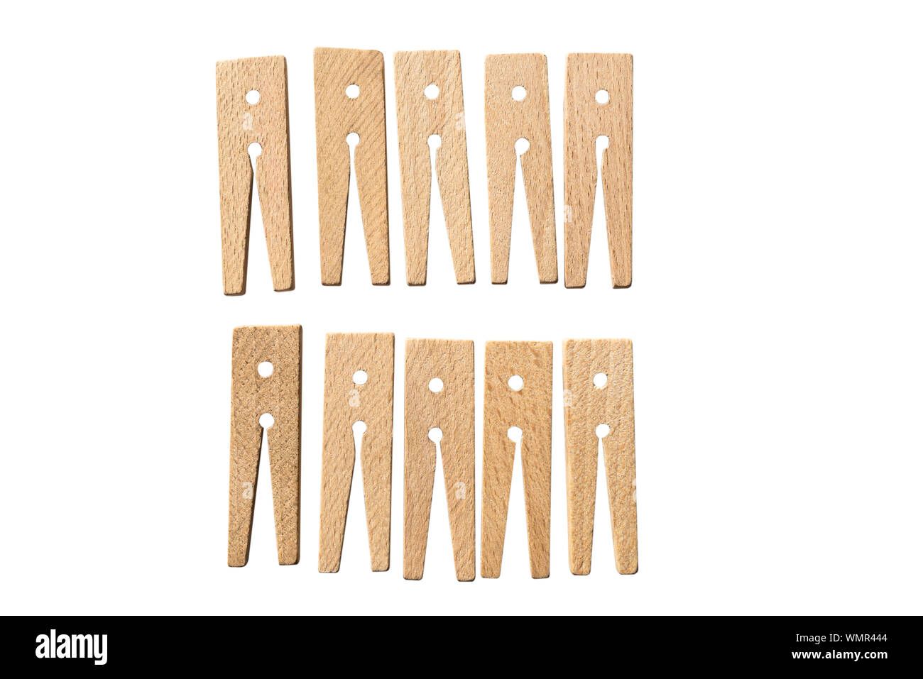 Ten wooden, old clips, in two rows isolated on a white background with ...