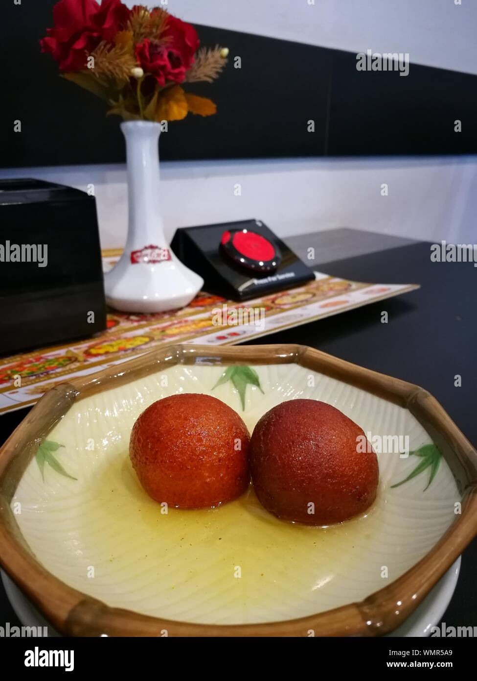 Eating gulab jamun hi-res stock photography and images - Alamy