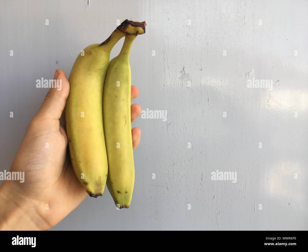 Hand bananas hi-res stock photography and images - Alamy