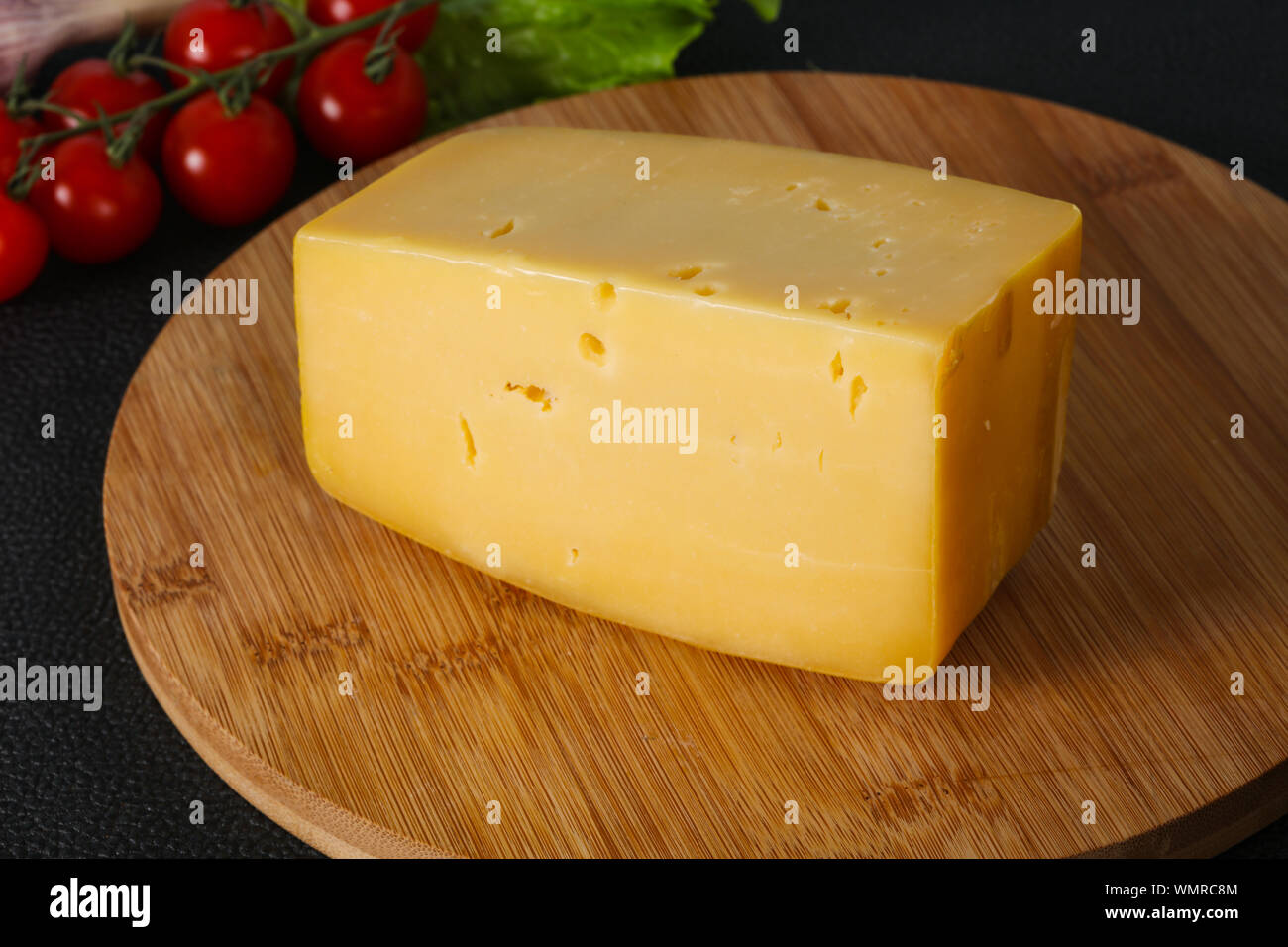 Swiss Hard yellow tasty cheese brick Stock Photo - Alamy