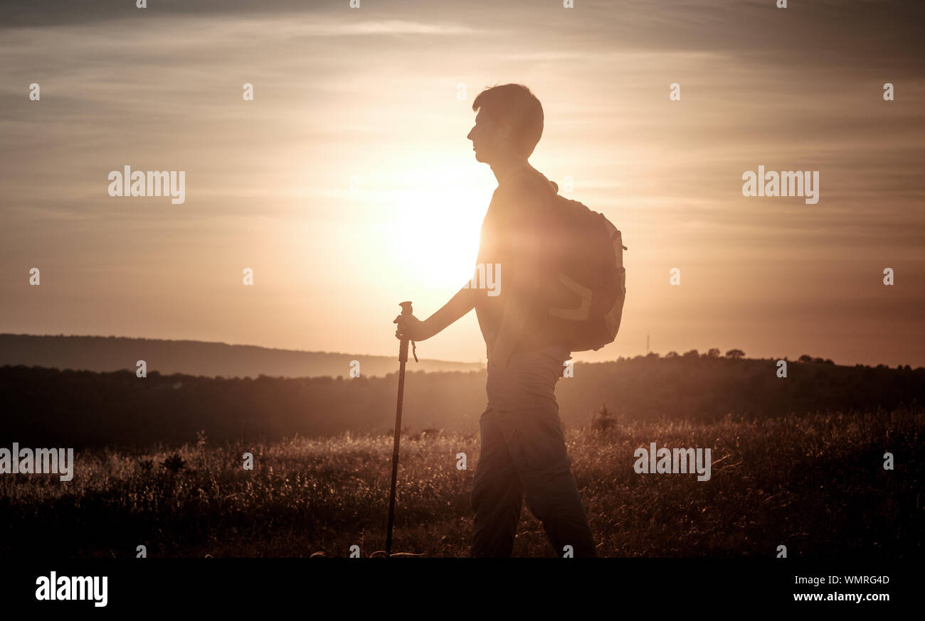 Silhouette of a champion on the high mountain. Sport and active life ...