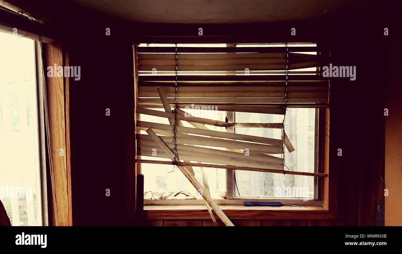 Broken Blinds On Window Of Abandoned House Stock Photo - Alamy