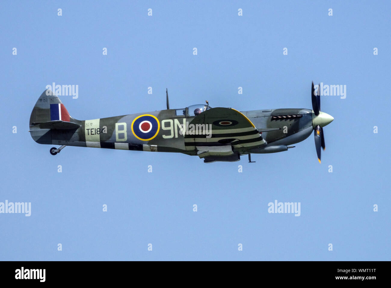 Supermarine Spitfire XV flying on blue sky Spitfire plane Stock Photo ...