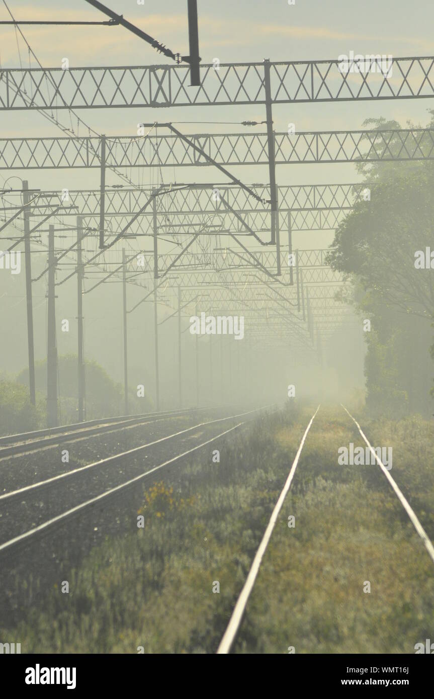 Railroad tracks on the embankment. Electric railway with pylons Stock ...