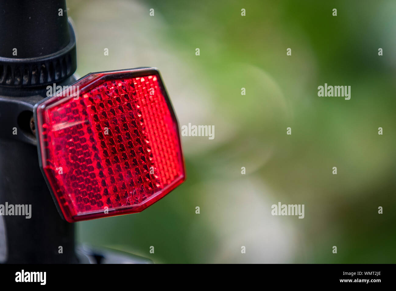 red reflex reflector on a bicycle Stock Photo - Alamy