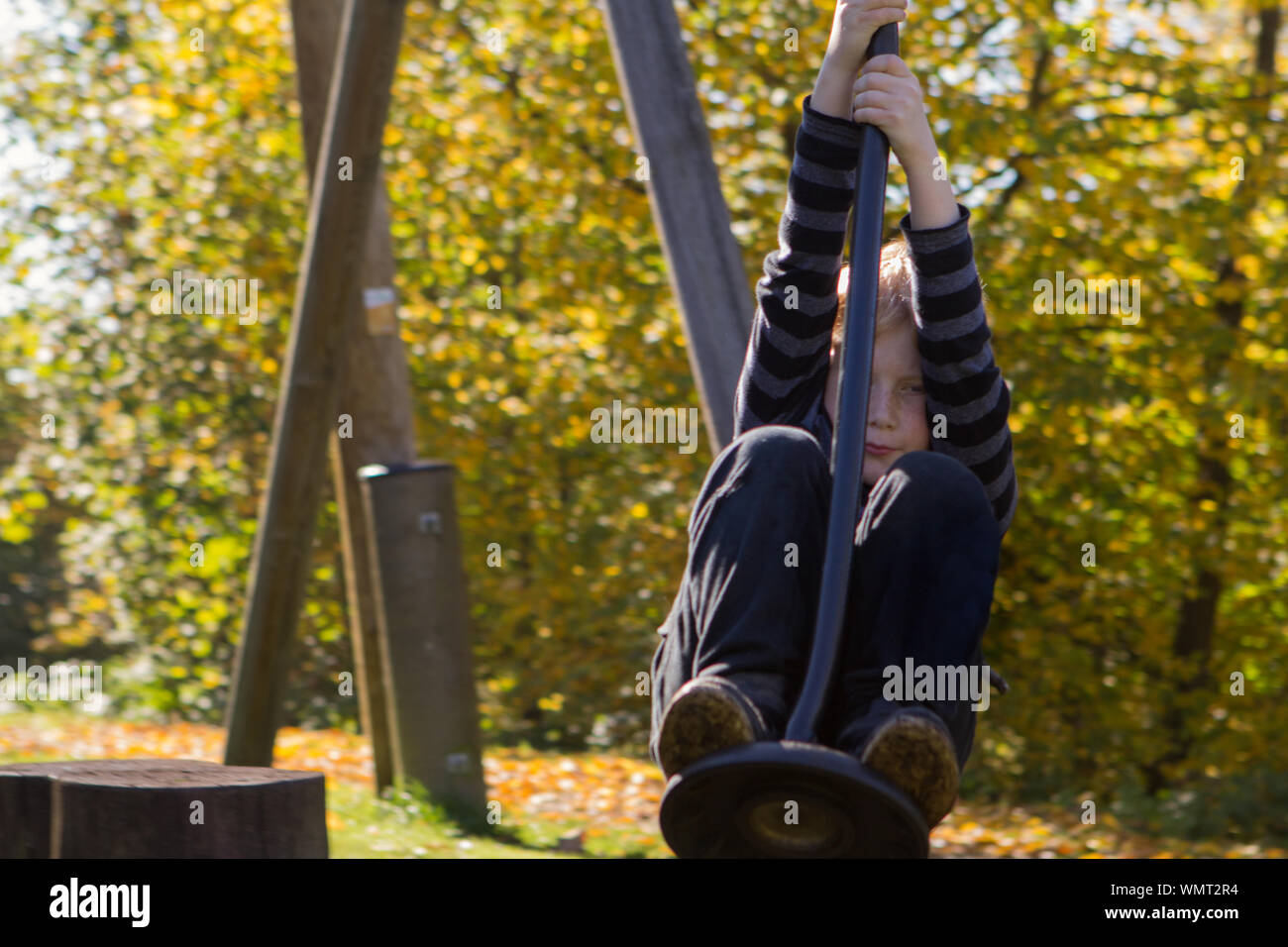Boy playing at playground hi-res stock photography and images - Alamy