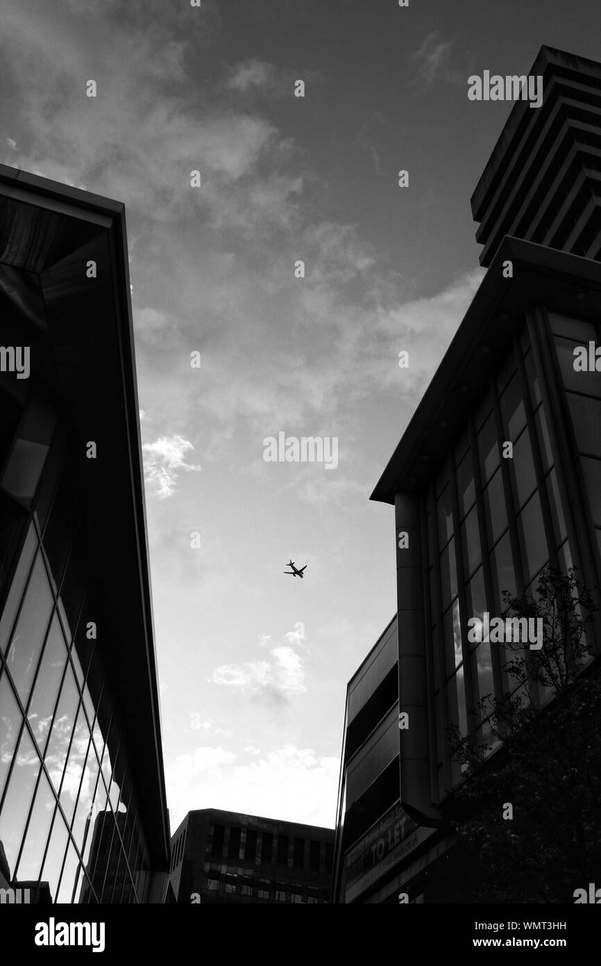 Airplane Flying Over Buildings High Resolution Stock Photography and ...