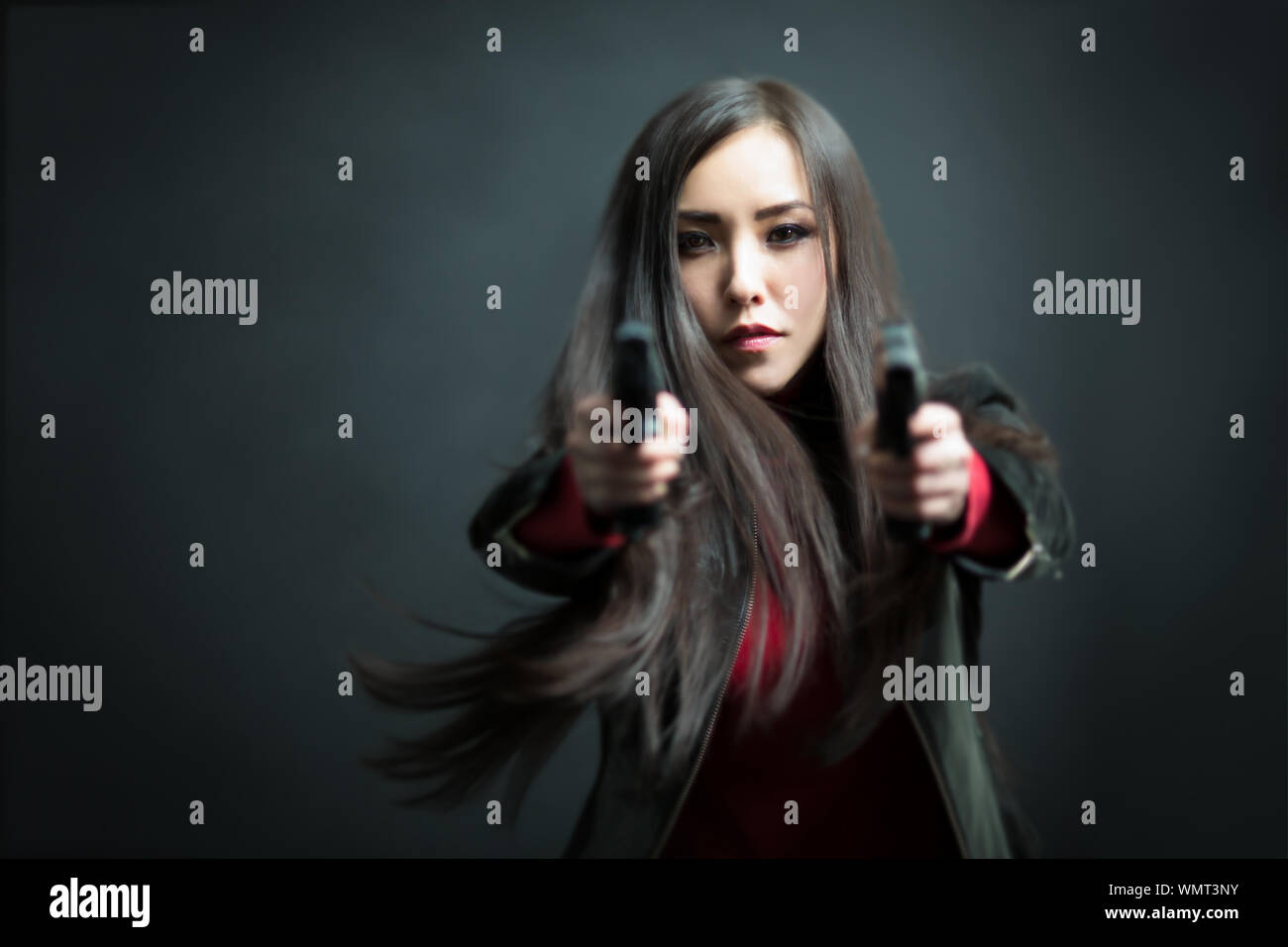 Women holding guns hi-res stock photography and images - Alamy