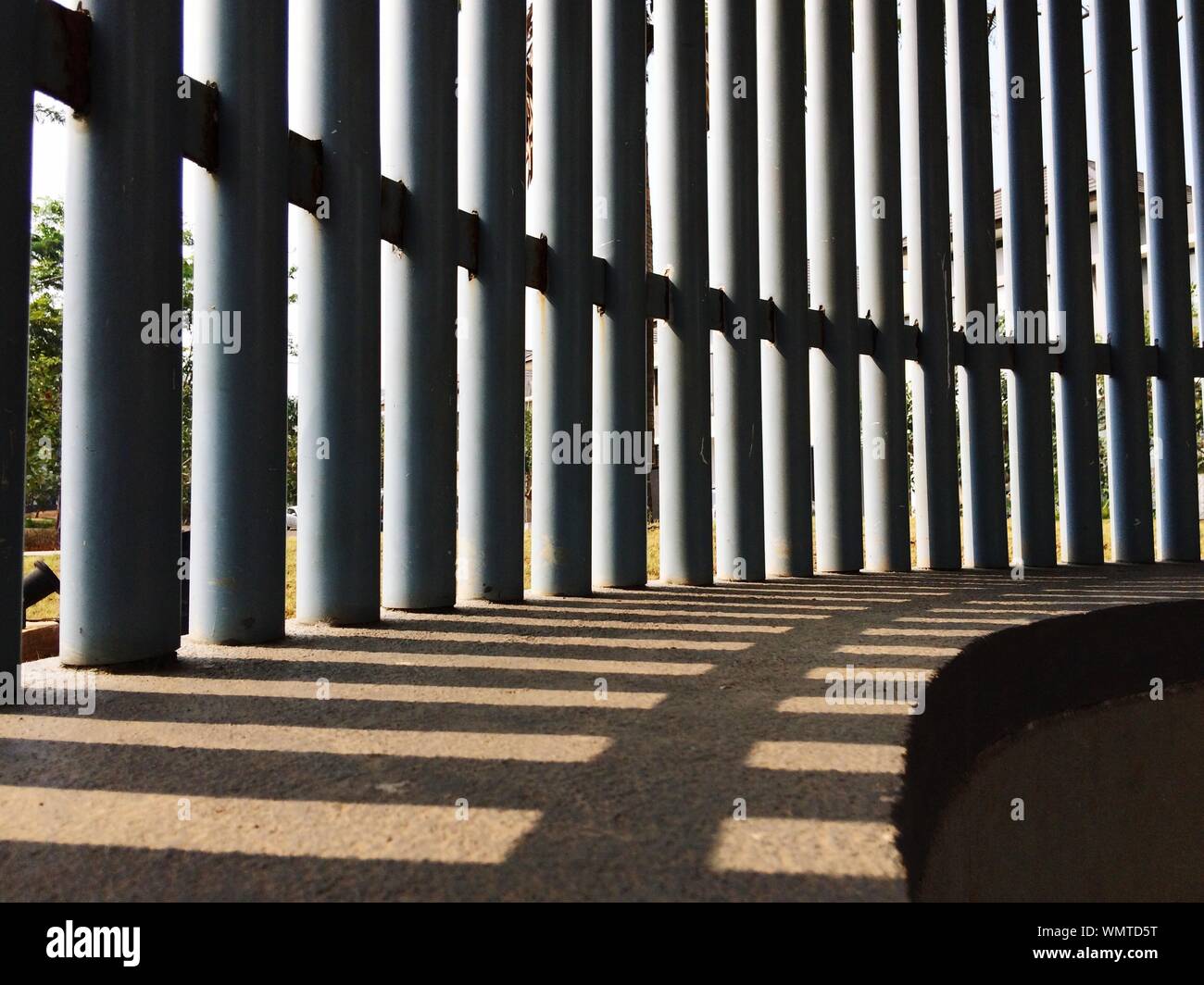 Shadow of fence hi-res stock photography and images - Alamy